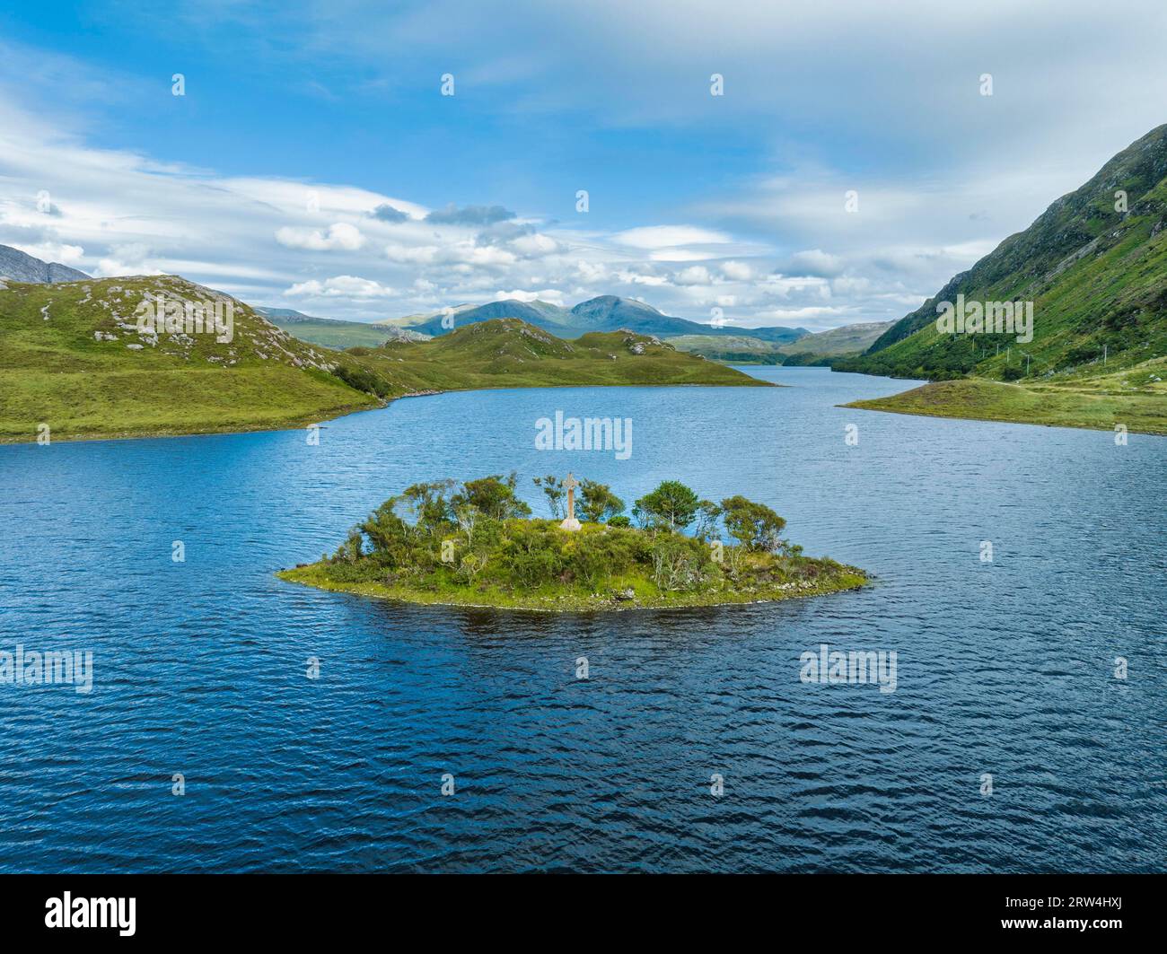 Aerial view of a small island with a Celtic stone cross in the ...