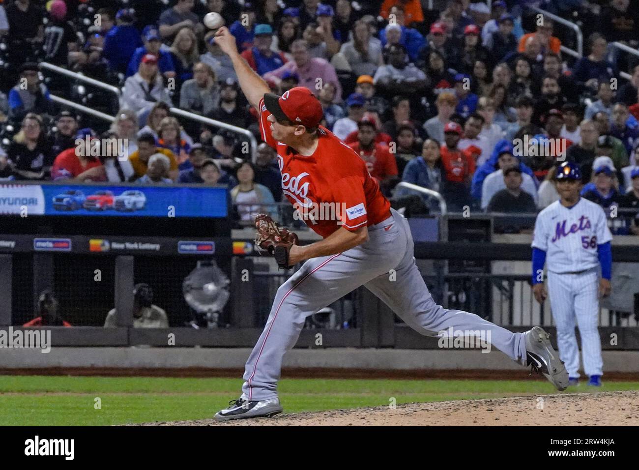 Cincinnati Reds' Derek Law pitches during the ninth inning of a baseball game against the New ...