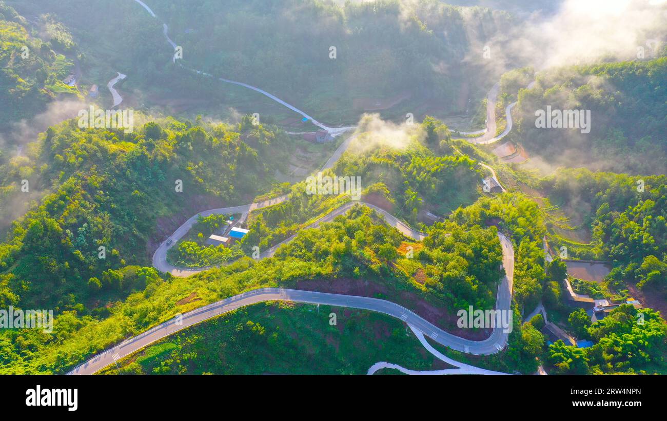 CHONGQING, CHINA - SEPTEMBER 14, 2023 - Vehicles drive along a rural ...