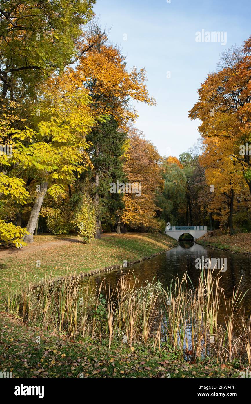 Canal and autumn trees in the Royal Lazienki Park (Polish: Lazienki ...