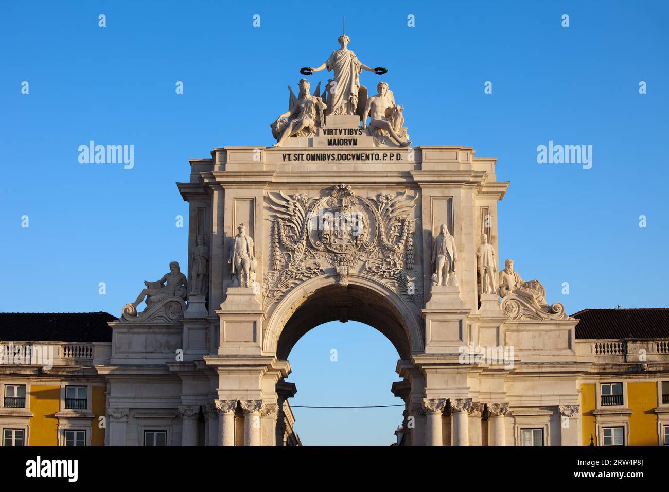 Rua Augusta Arch at sunrise in Lisbon, Portugal. Statues at the top ...