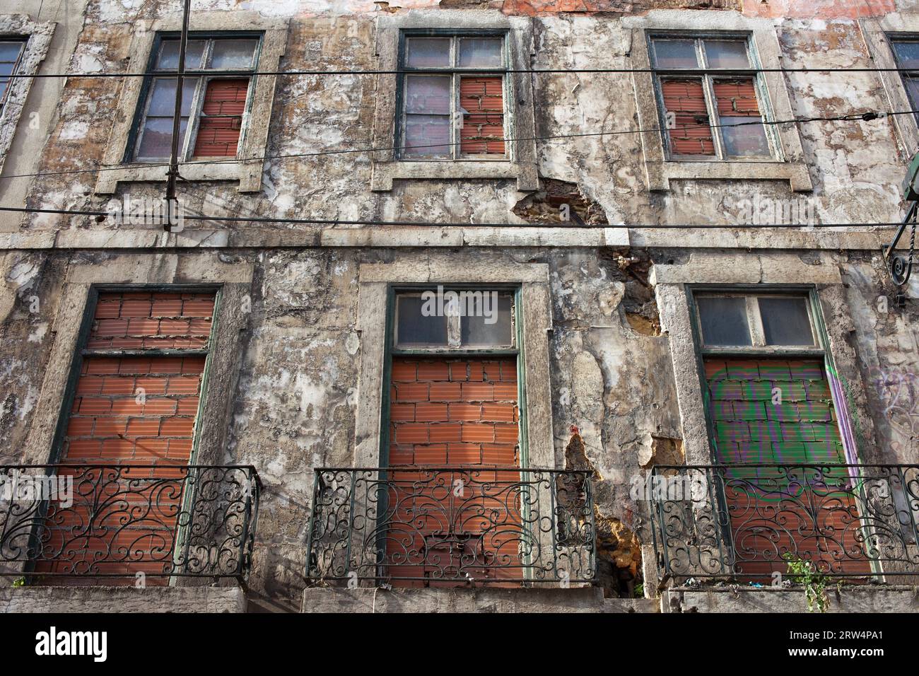 Facade of an old apartment building in Lisbon, Portugal with brick ...