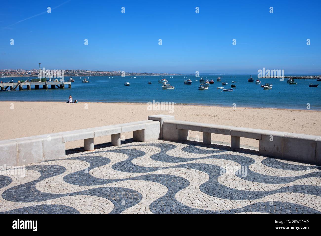 Beach and promenade by the Atlantic Ocean in resort town of Cascais in ...