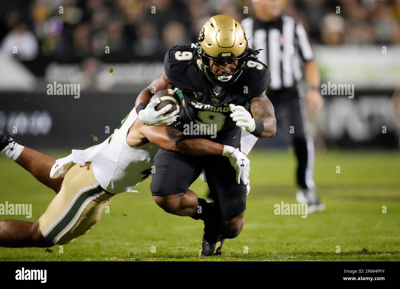 Colorado running back Anthony Hankerson (9) is stopped after a short ...