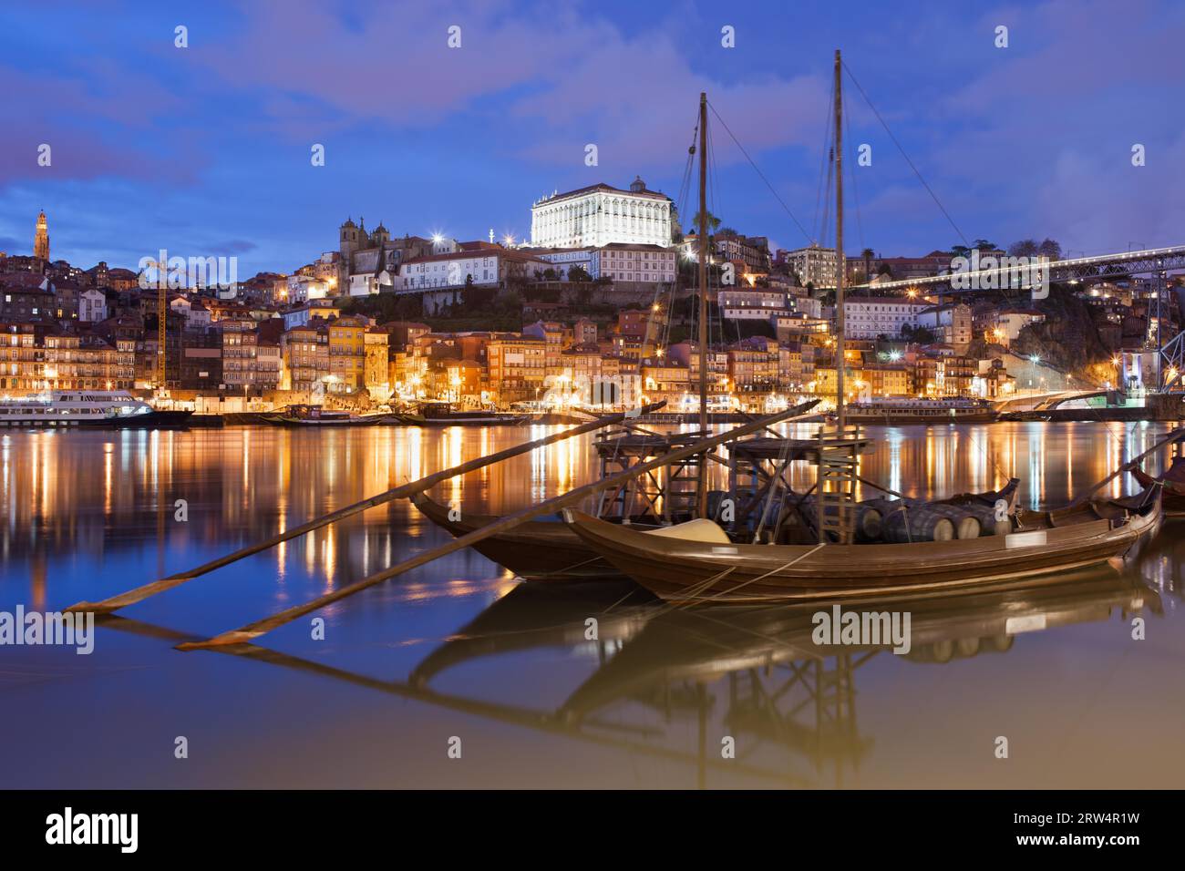 City of Porto at night in Portugal. Rabelo traditional Portuguese cargo ...