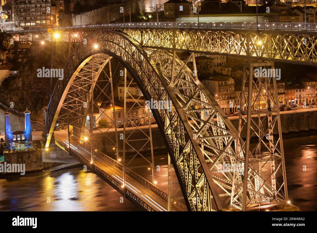 City of Porto at night in Portugal and Dom Luis I metal arch bridge ...