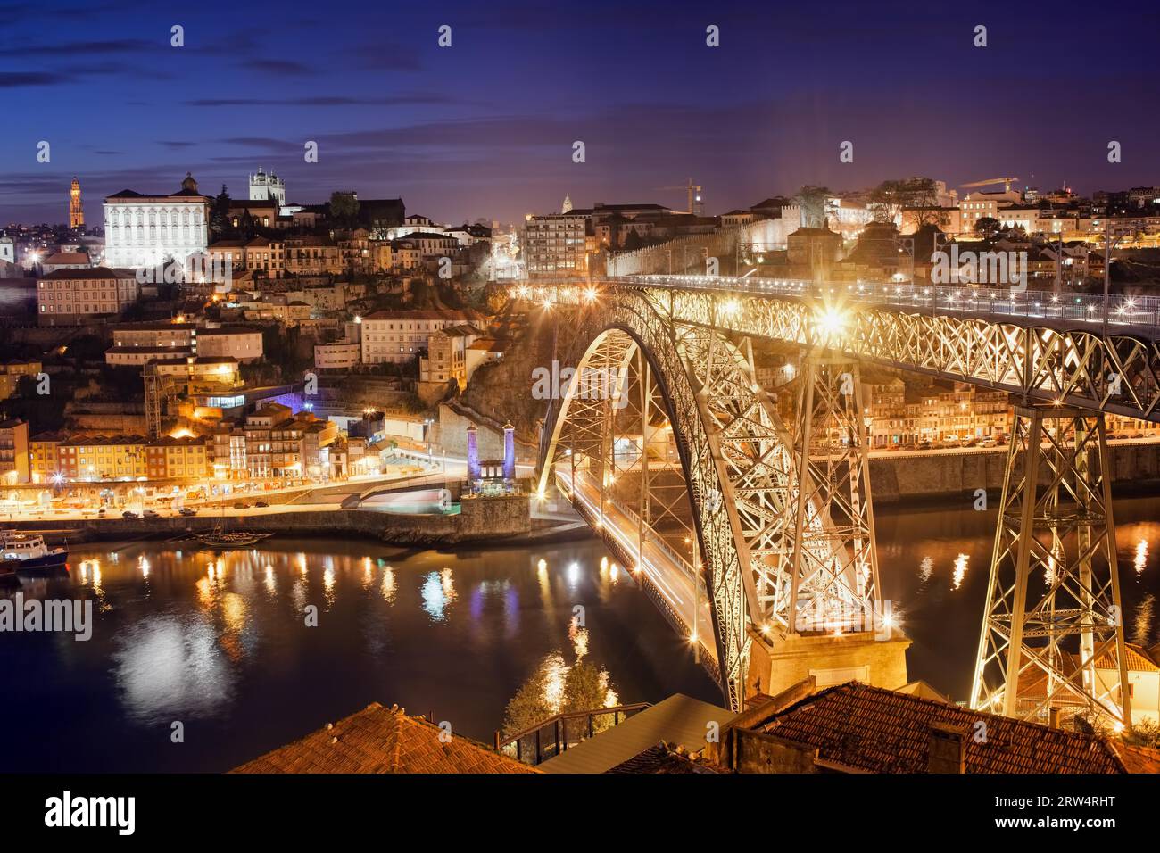 City of Porto in Portugal by night, illuminated Ponte Luiz I Bridge ...