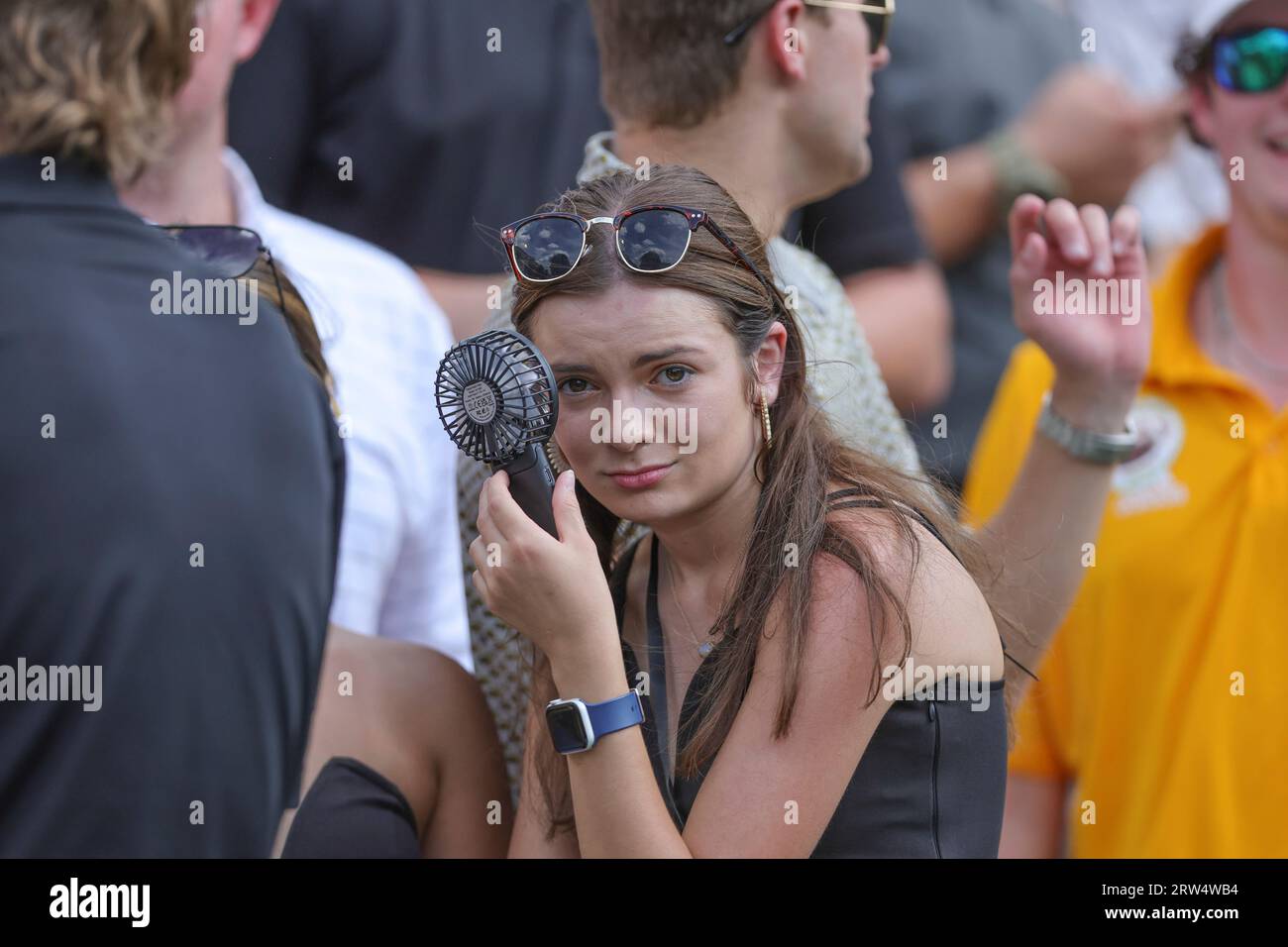 SEP 16, 2023: A Southern Miss fan uses her fan to cool off on a hot and ...