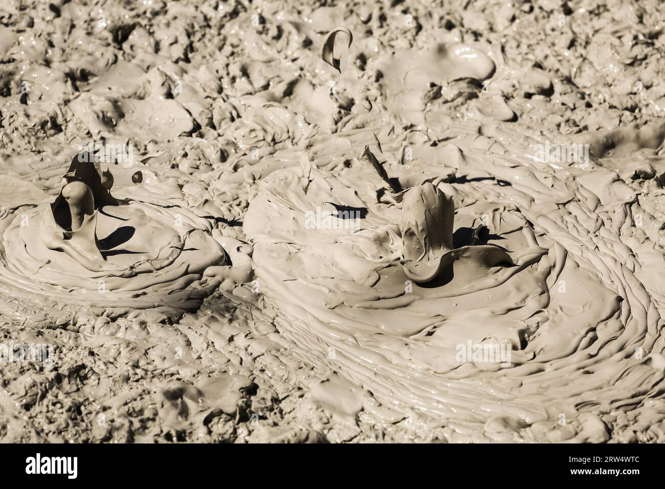 Bubbling mudhole in volcanic area Stock Photo - Alamy