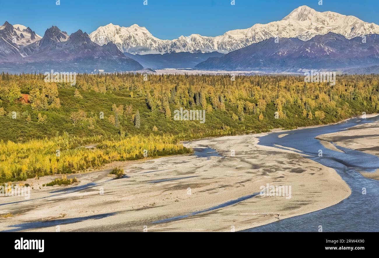 Scenic fall landscape with river and snow-capped mountains in Denali ...