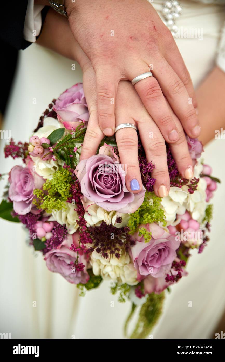 Wedding couple hand in hand Stock Photo - Alamy