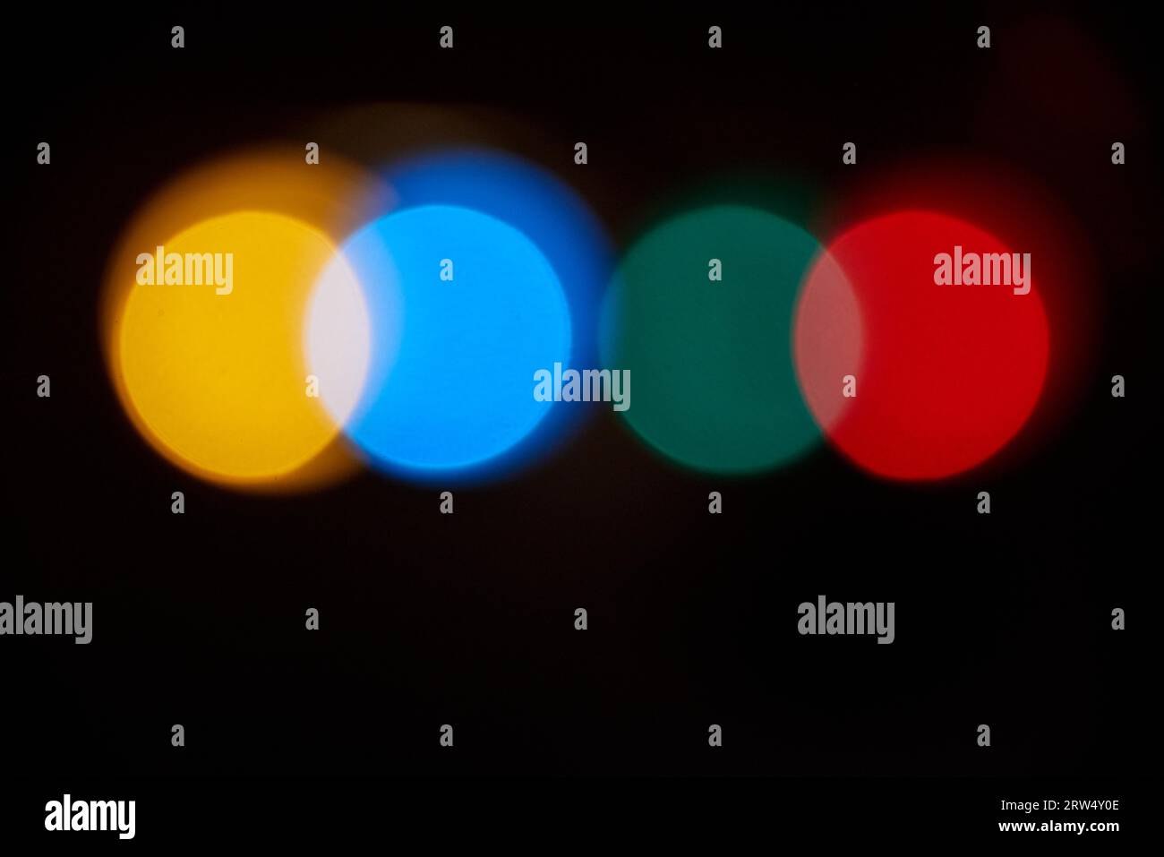 Four different lights as bokeh blurred Stock Photo - Alamy