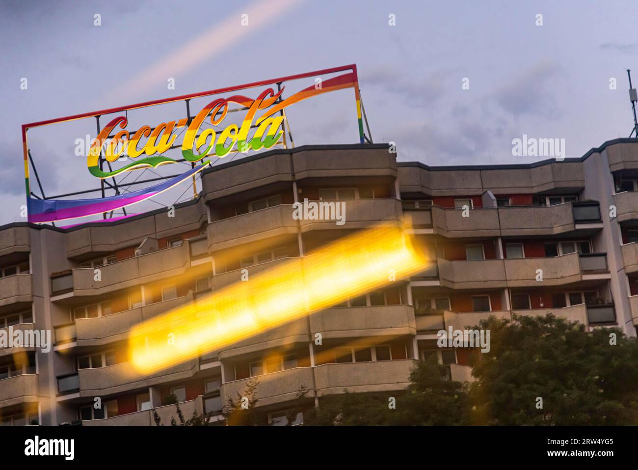 Coca-Cola advertising, logo in rainbow colours on the roof of a house ...