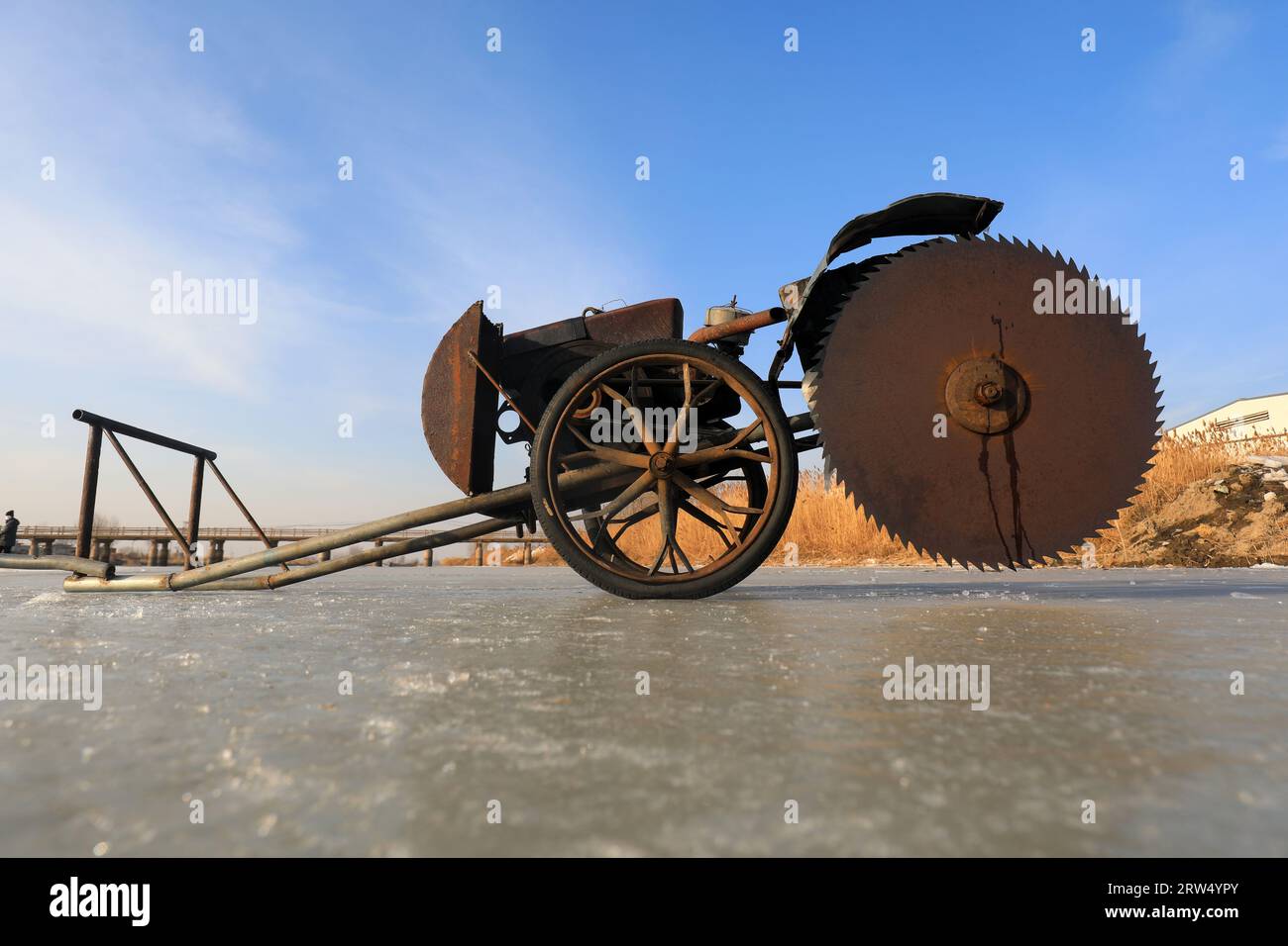 Electric saw for cutting river ice, North China Stock Photo - Alamy