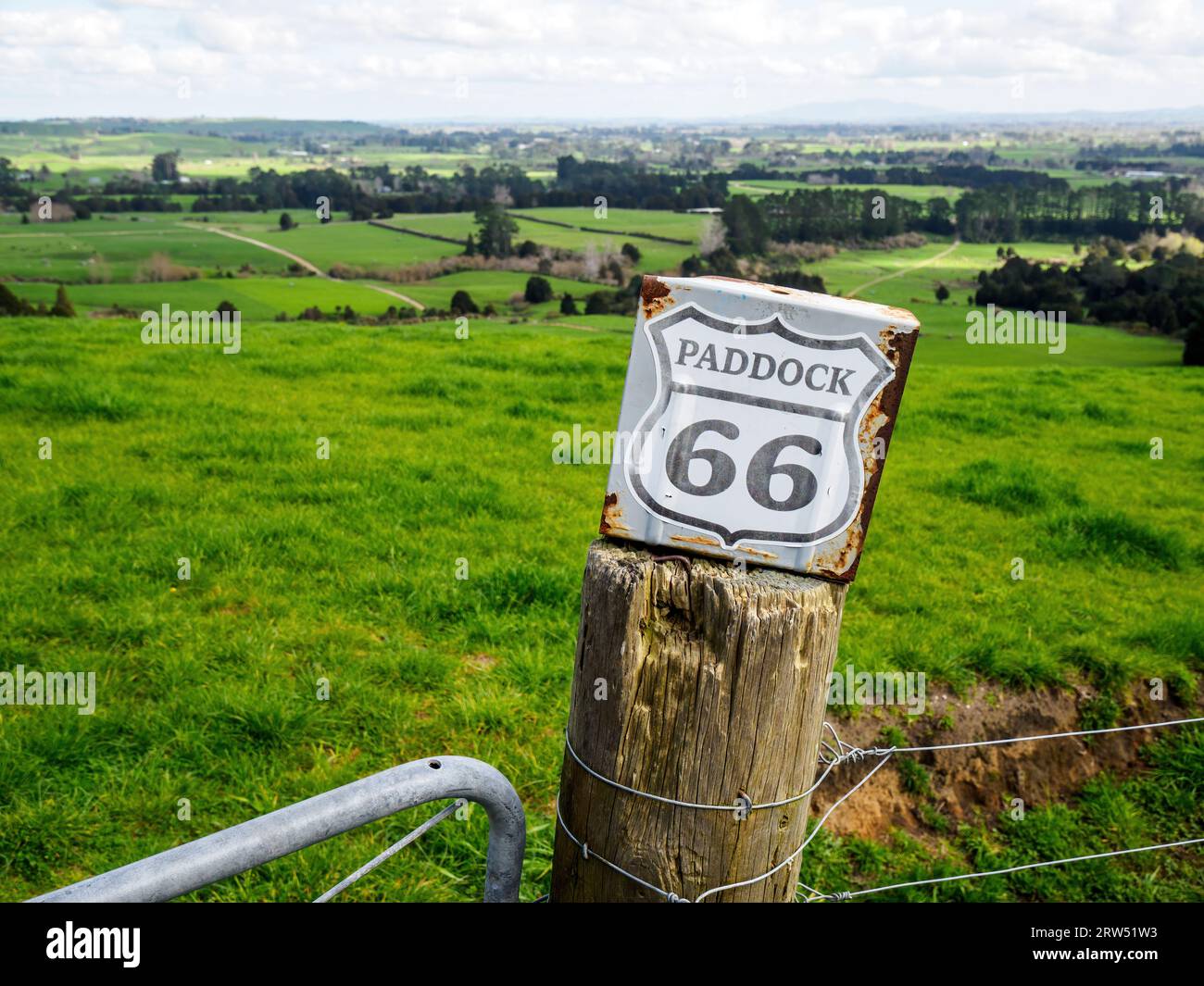 Green pastures with Paddock 66 sign. Wairere falls track, Waikato ...