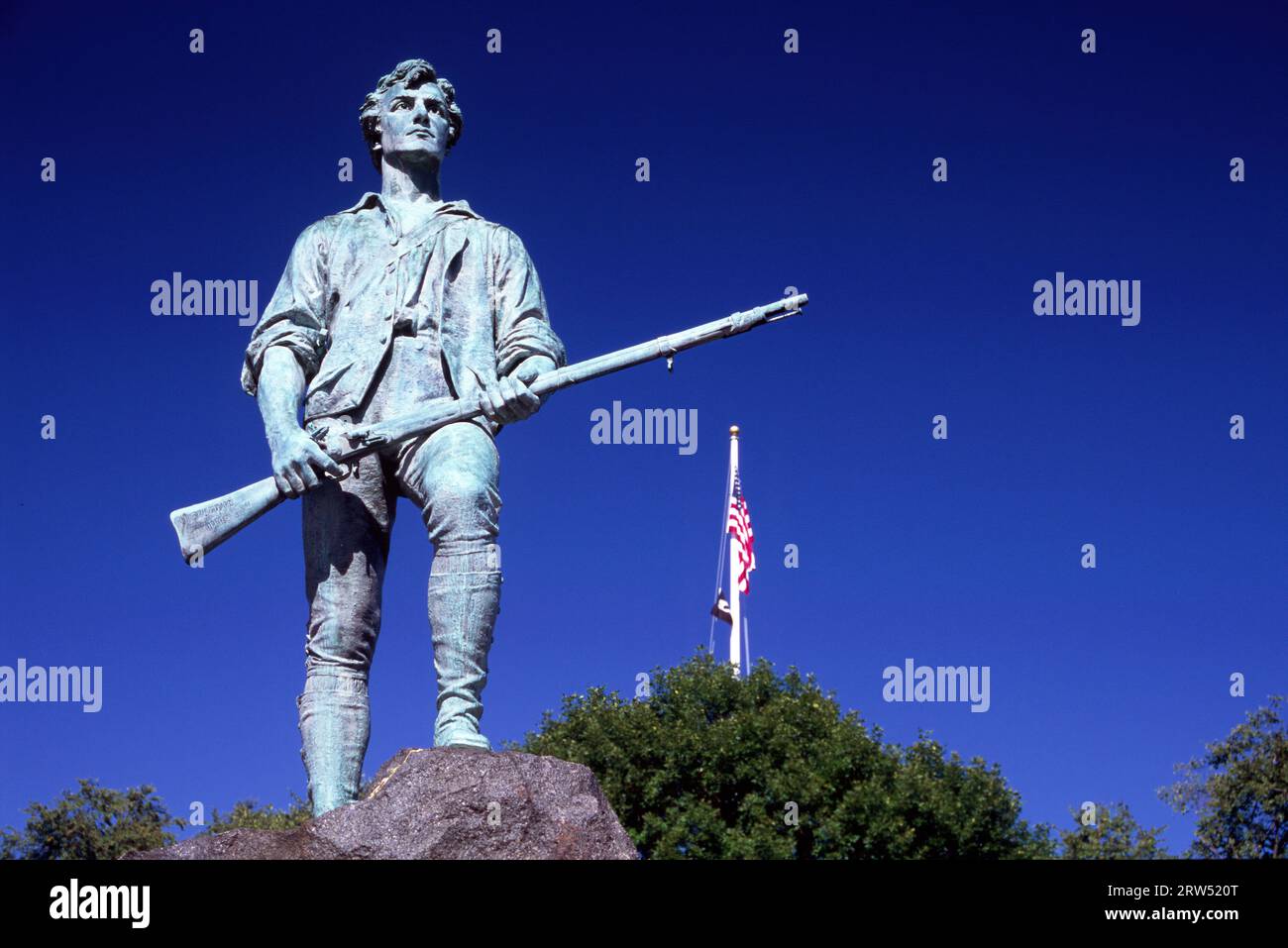 Captain Parker statue on Battle Green with American flag, Lexington ...