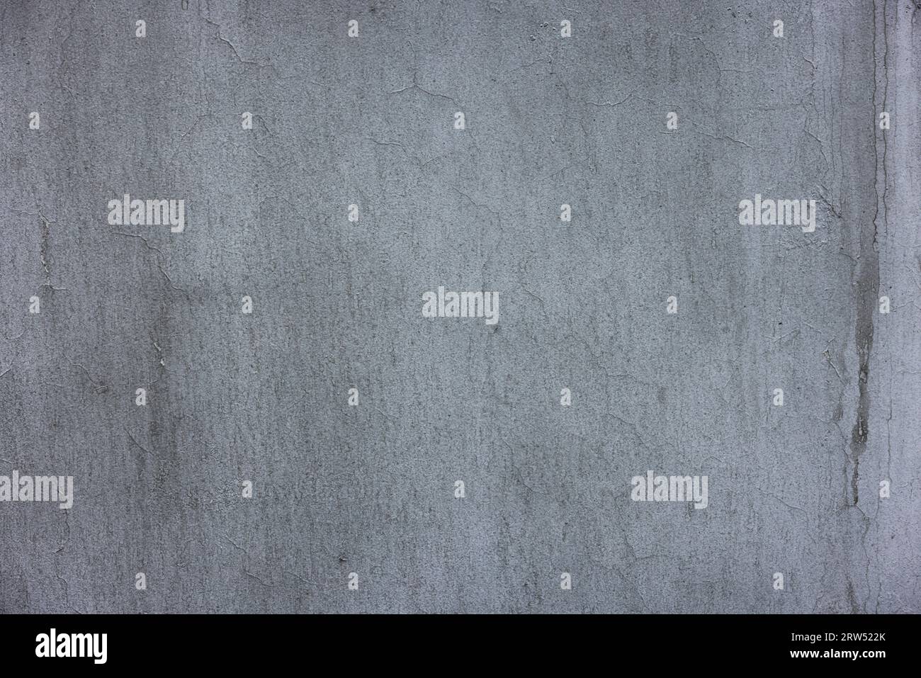 concrete outdoor wall with matte gray paint and smudges - full-frame ...