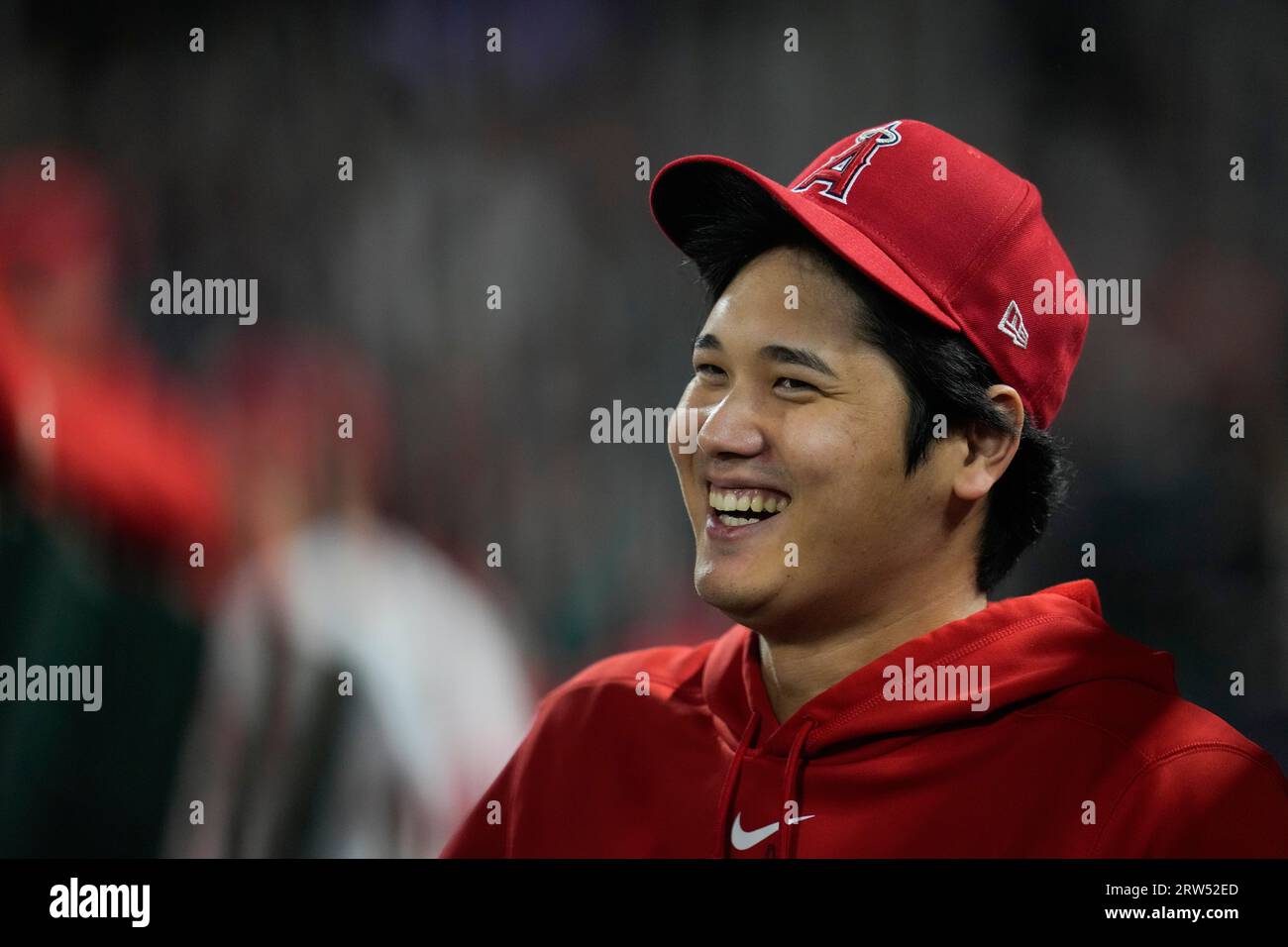 Los Angeles Angels' Shohei Ohtani laughs in the dugout during the ninth ...