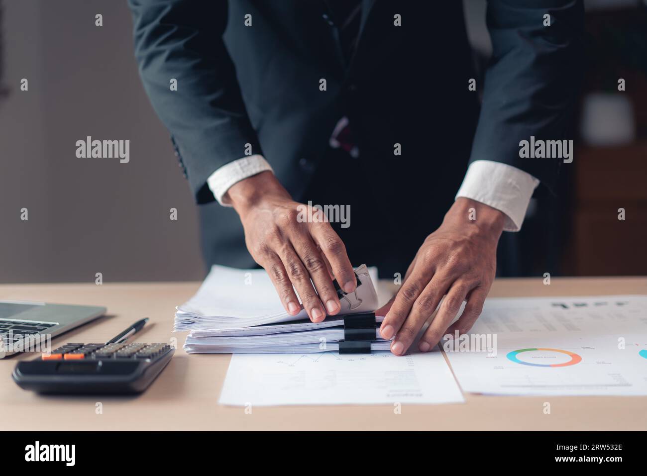 Businessman stacking document after checking financial and accounting ...