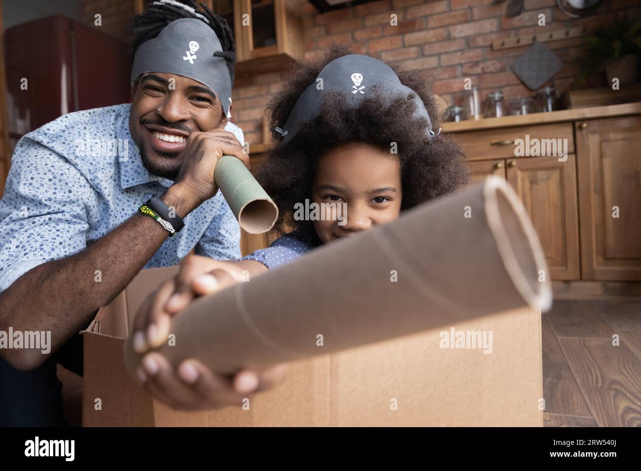Head shot portrait happy family playing pirates having fun Stock Photo ...
