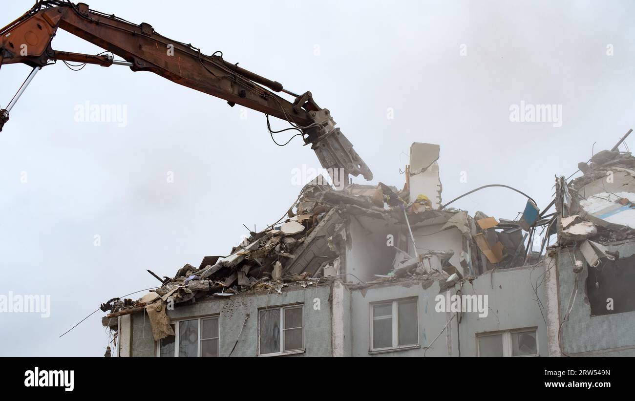 Demolition of a residential house using building hydraulic shears Stock ...