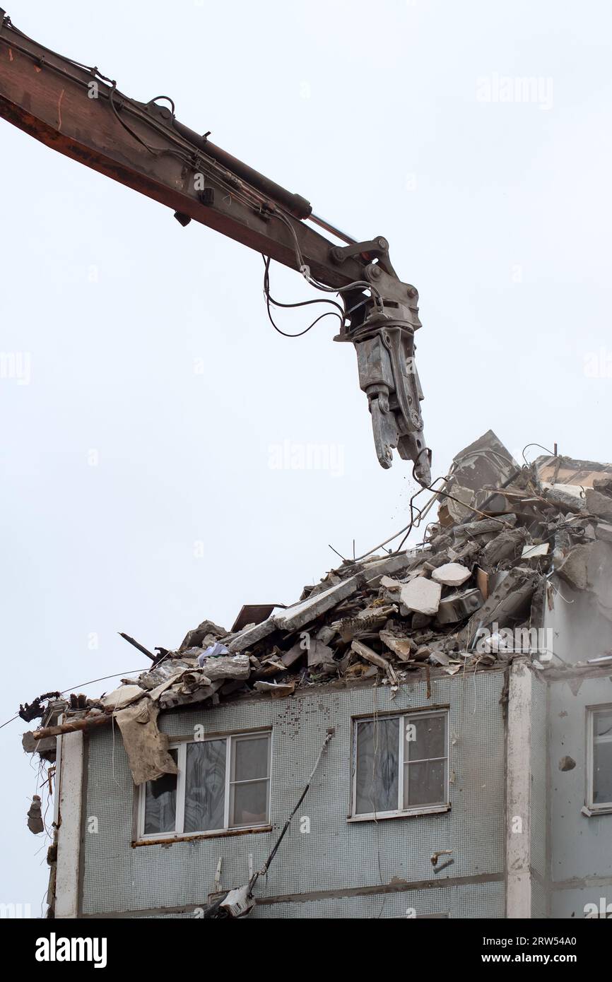 Demolition of a residential house using building hydraulic shears Stock ...