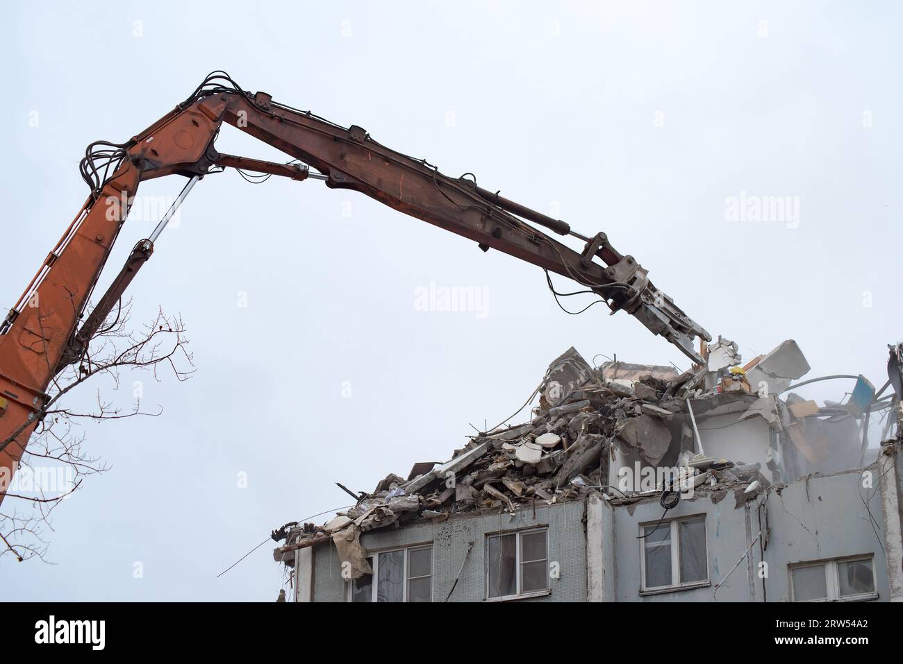 Demolition of a residential house using building hydraulic shears Stock ...