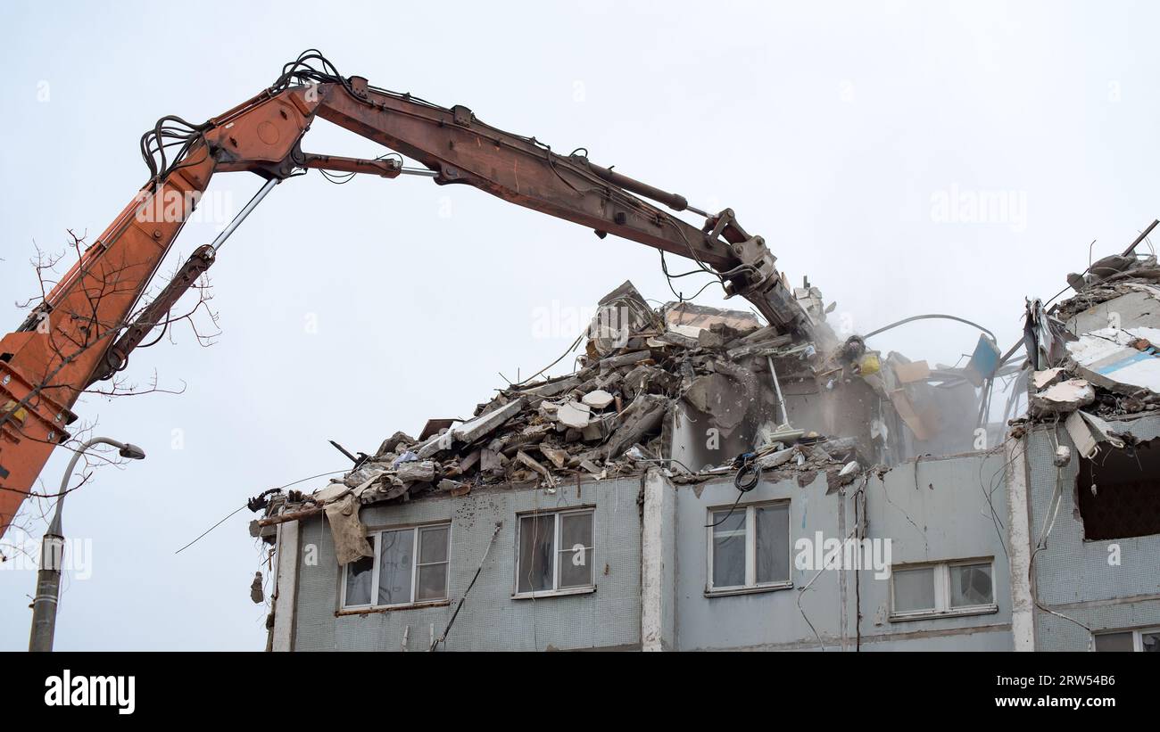 Demolition of a residential house using building hydraulic shears Stock ...