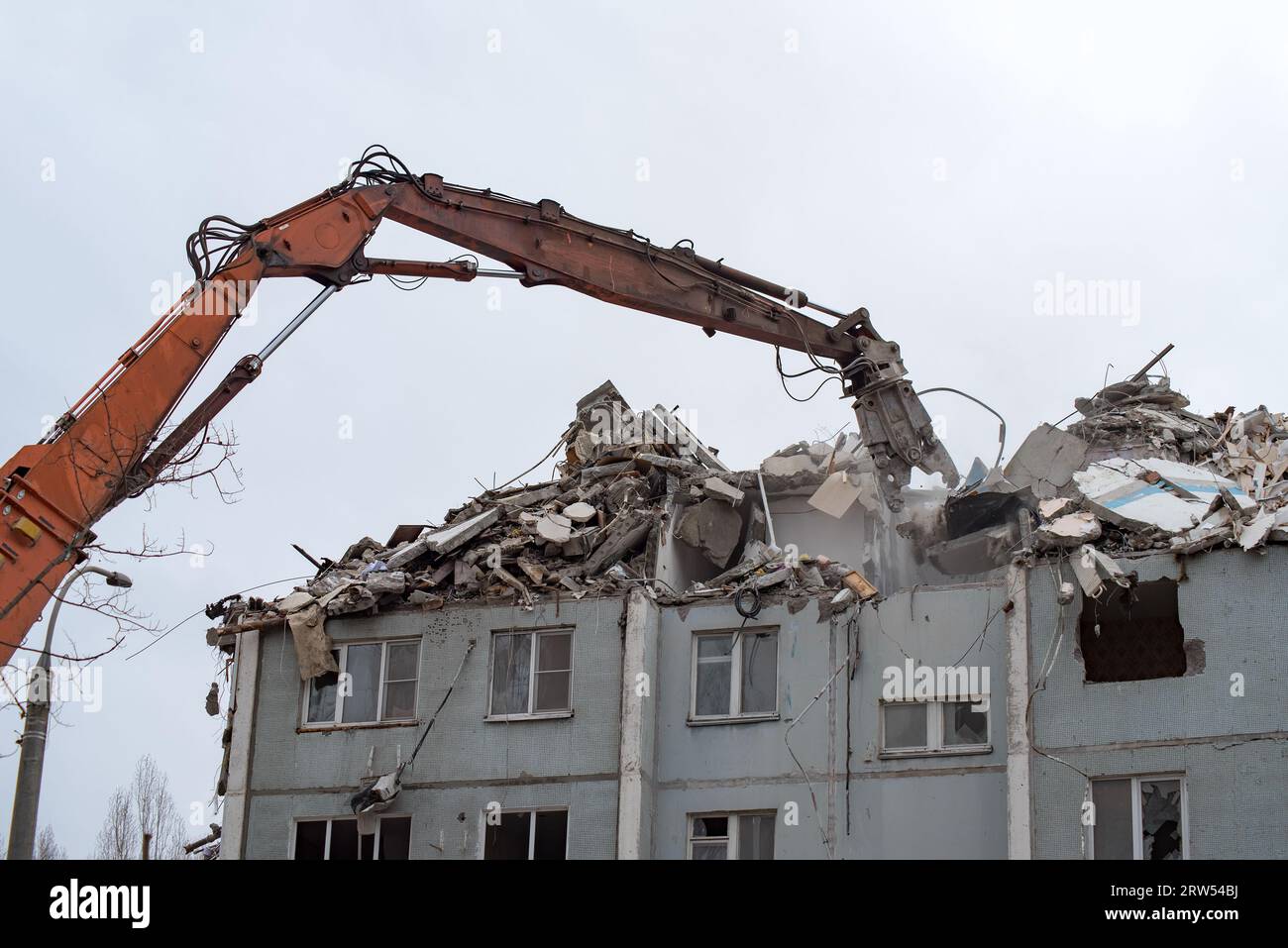 Demolition of a residential house using building hydraulic shears Stock ...