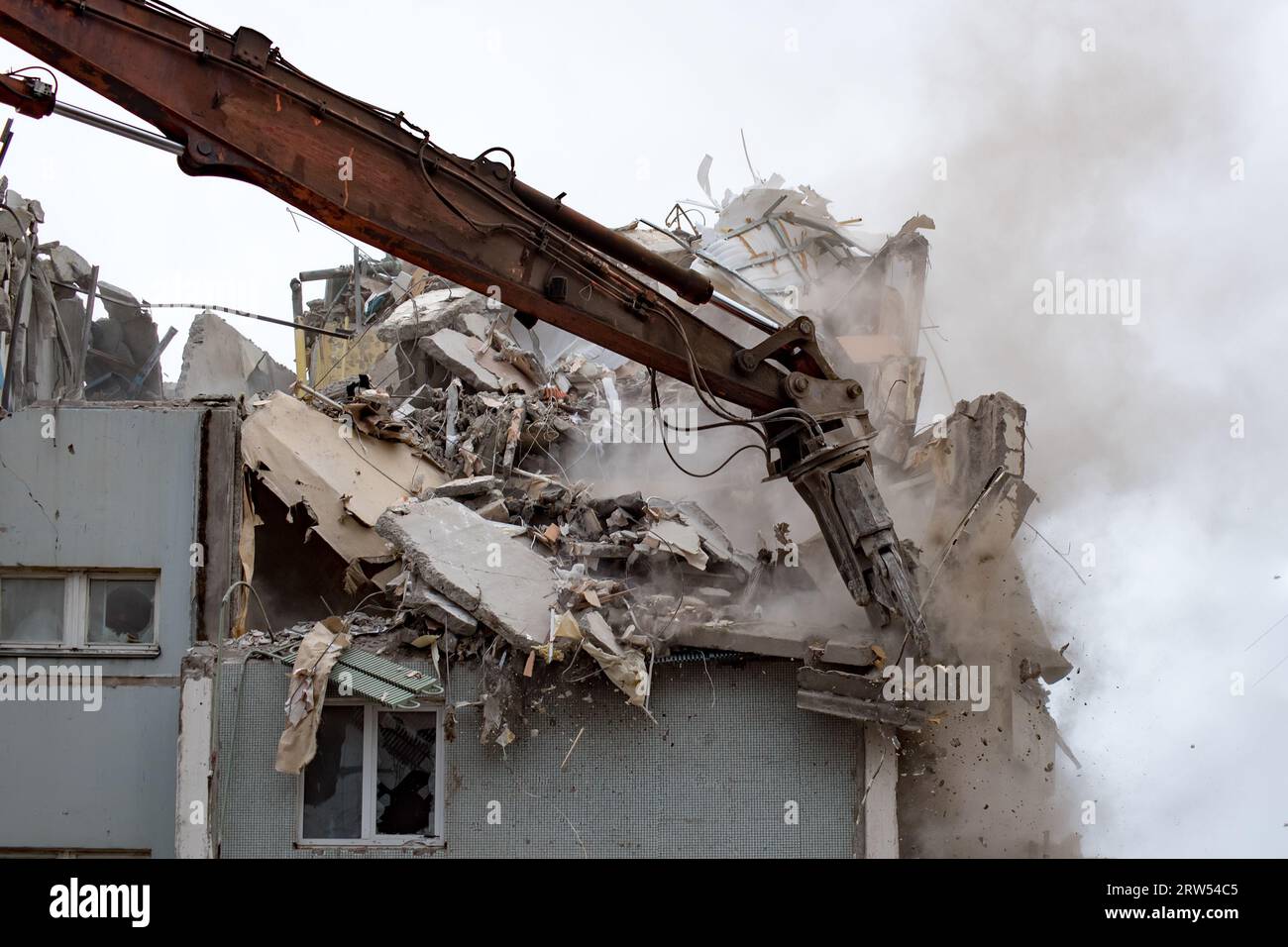 Demolition of a residential house using building hydraulic shears Stock ...