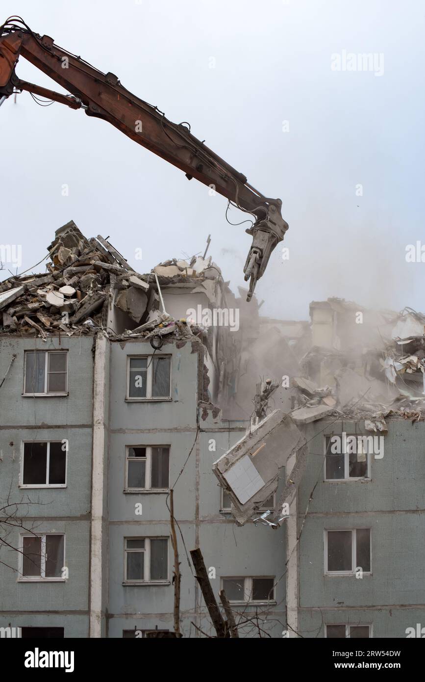 Demolition of a residential house using building hydraulic shears Stock ...