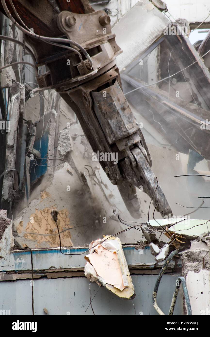 Demolition of a residential house using building hydraulic shears Stock ...