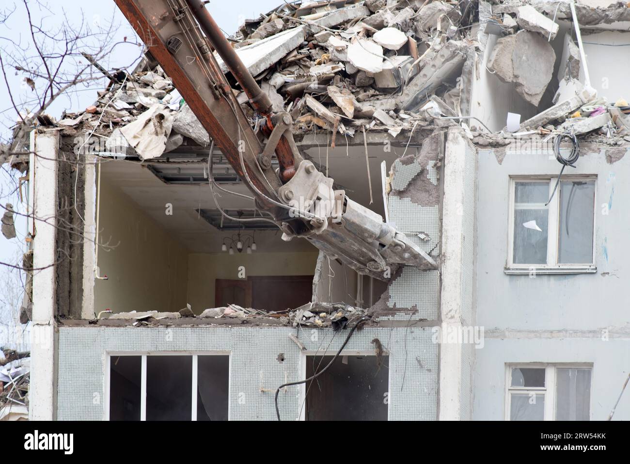 Demolition of a residential house using building hydraulic shears Stock ...