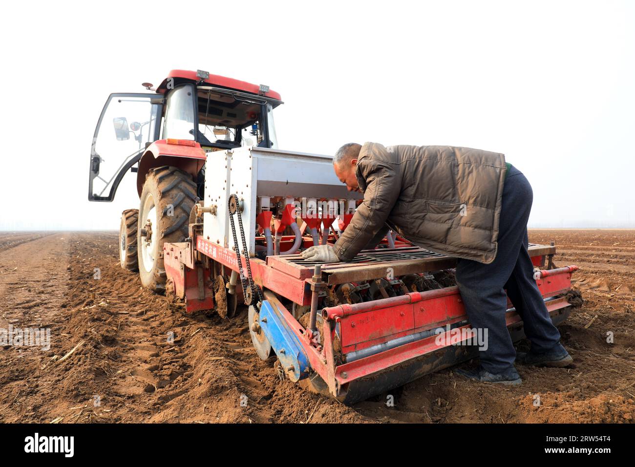 LUANNAN COUNTY, Hebei Province, China - March 9, 2021: Farmers adjust ...
