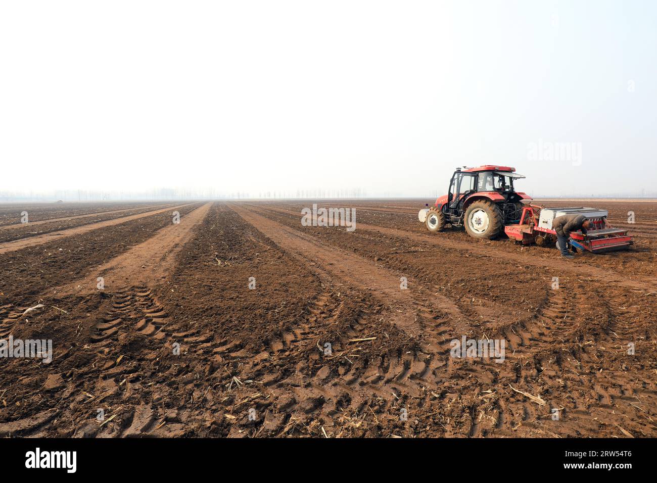 LUANNAN COUNTY, Hebei Province, China - March 9, 2021: Farmers adjust ...