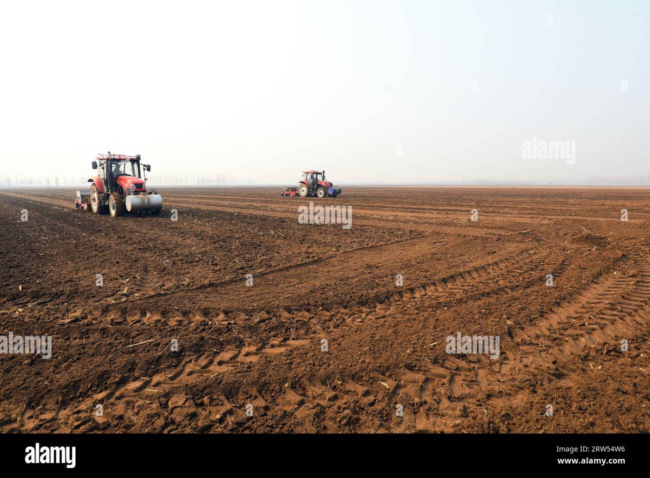 Farmers drive planters to grow peas on the farm Stock Photo - Alamy