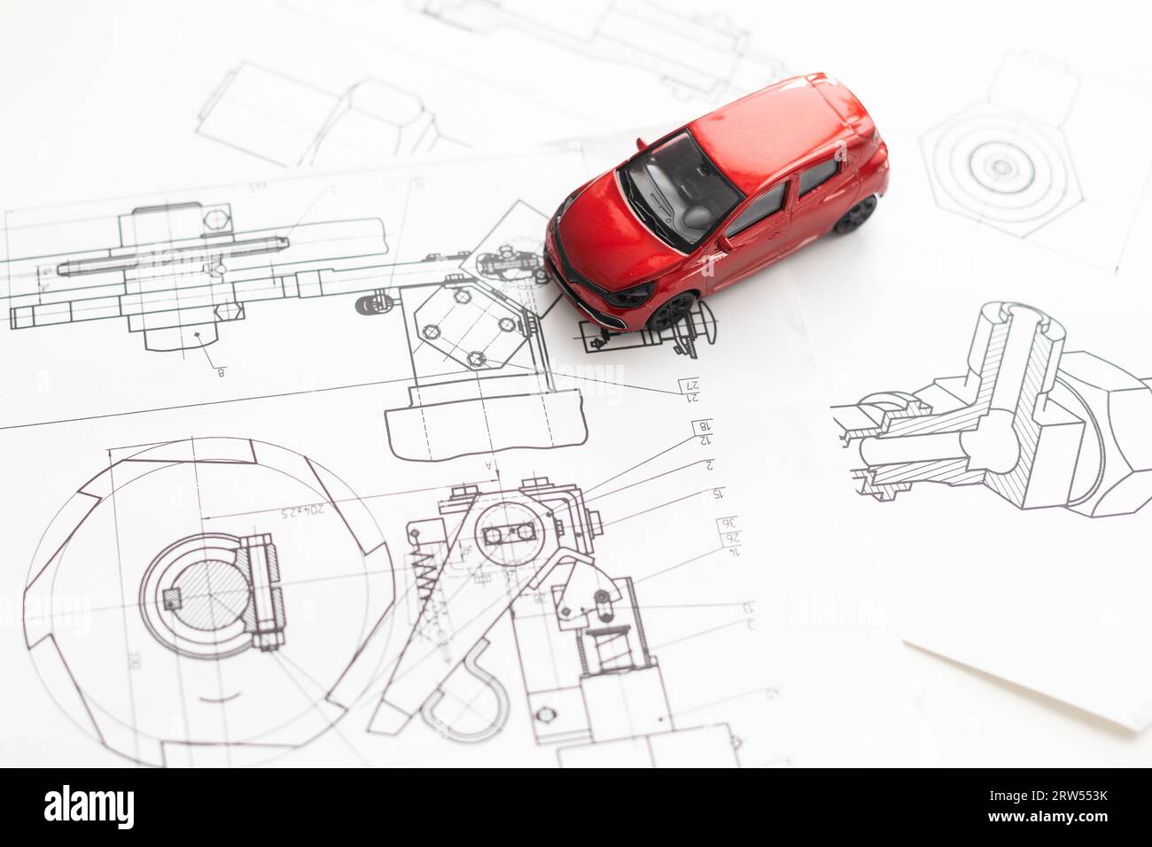 small car model and blueprint sheets Stock Photo - Alamy
