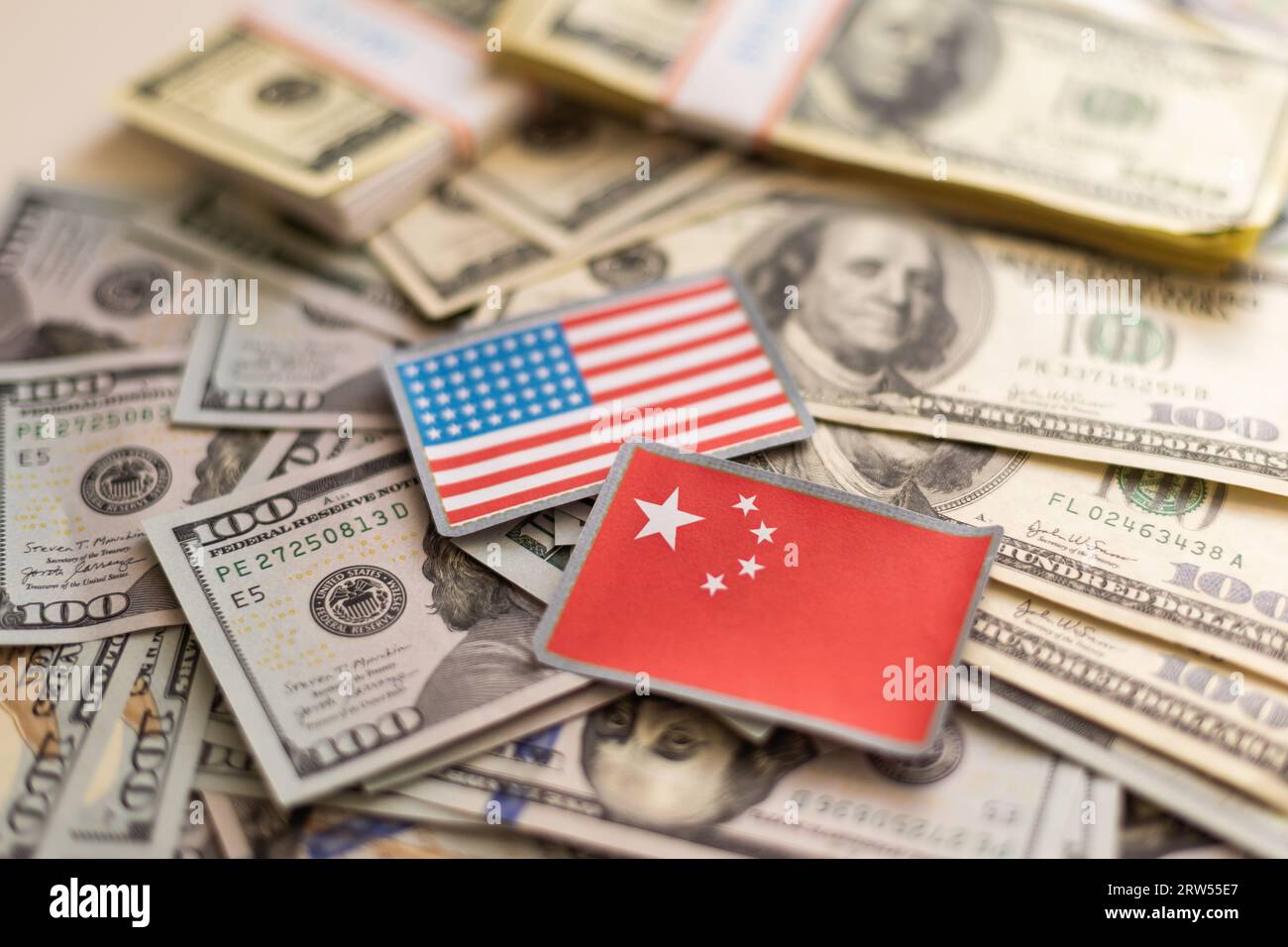 Usa and China flag on A pile of dollar banknote as a money background ...