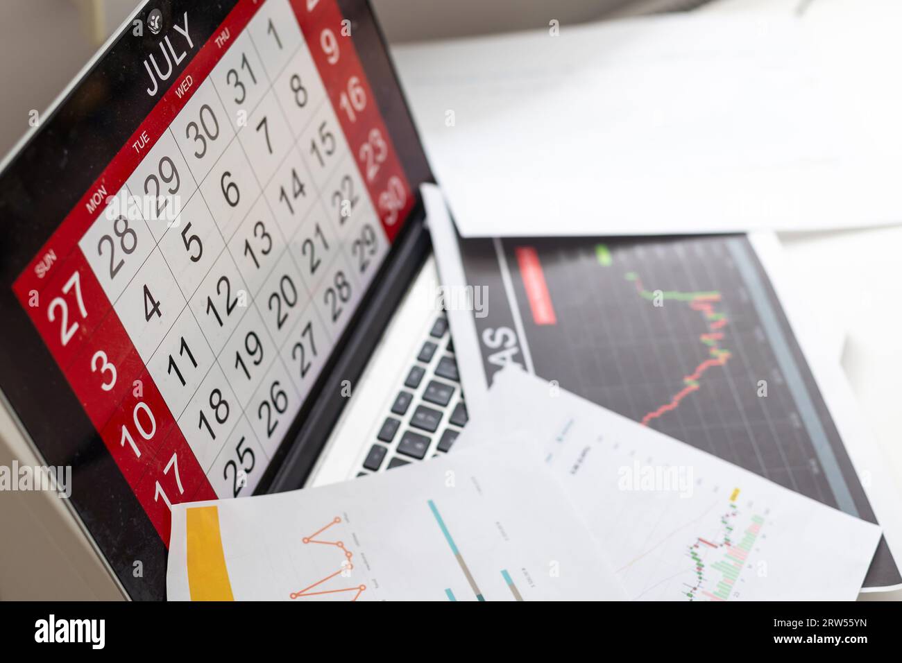 Preparing report. Blue graphs and charts. Business reports and pile of ...