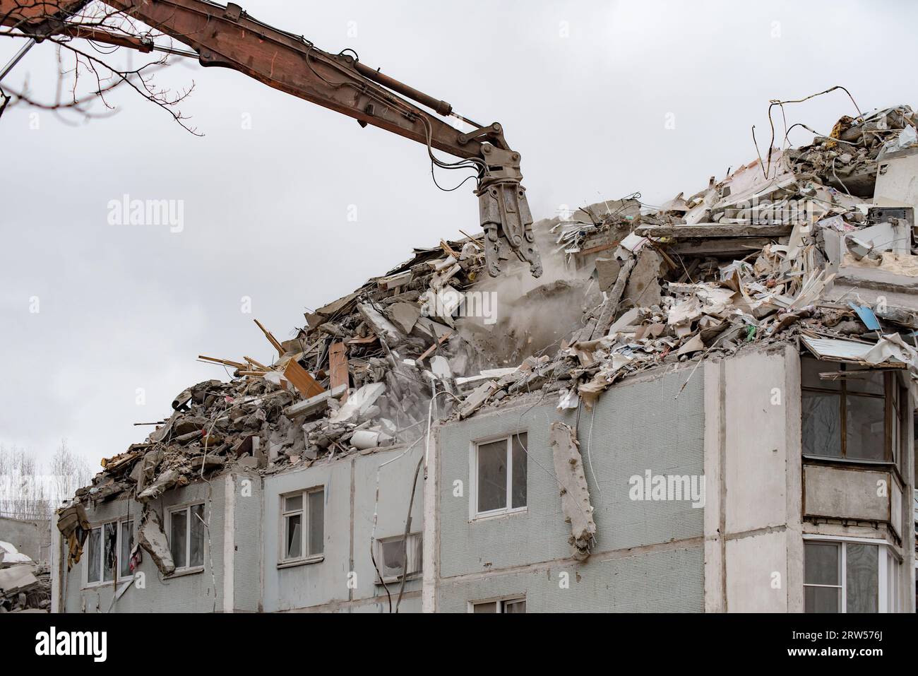 Demolition of a residential house using building hydraulic shears Stock ...