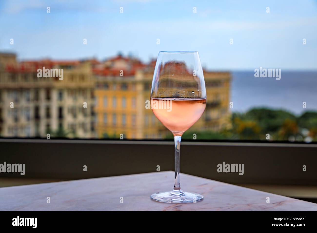 Glass of rose provencal wine at rooftop bar above the Old Town Vieille ...