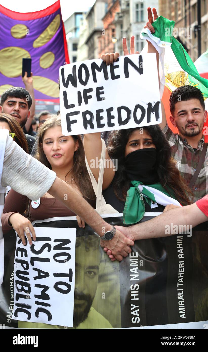 Protesters with placards saying ‘Women Life Freedom' and 'No To Islamic ...