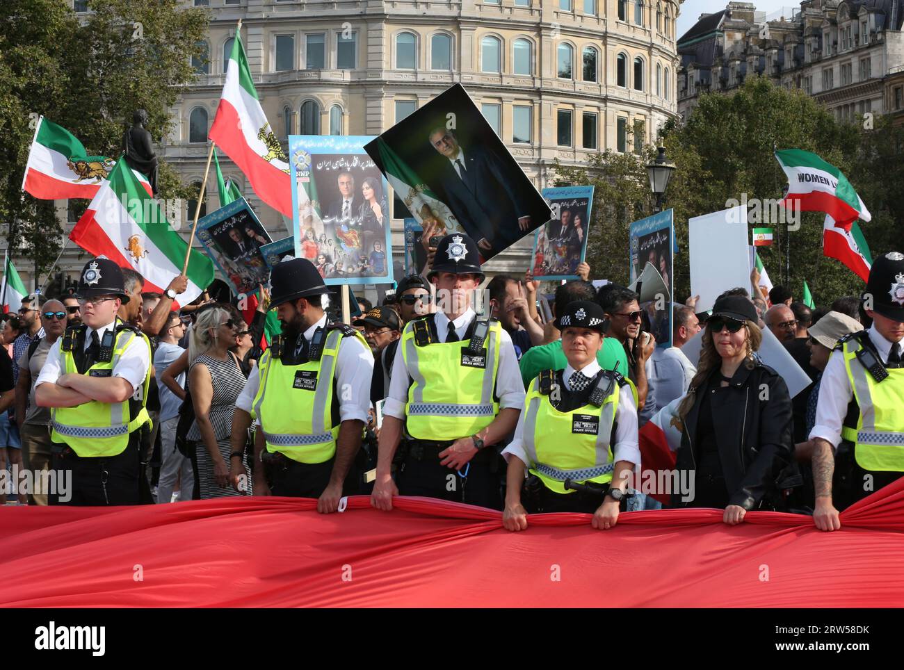 Protesters hold portraits of Crown Prince of Iran Reza Pahlavi as ...