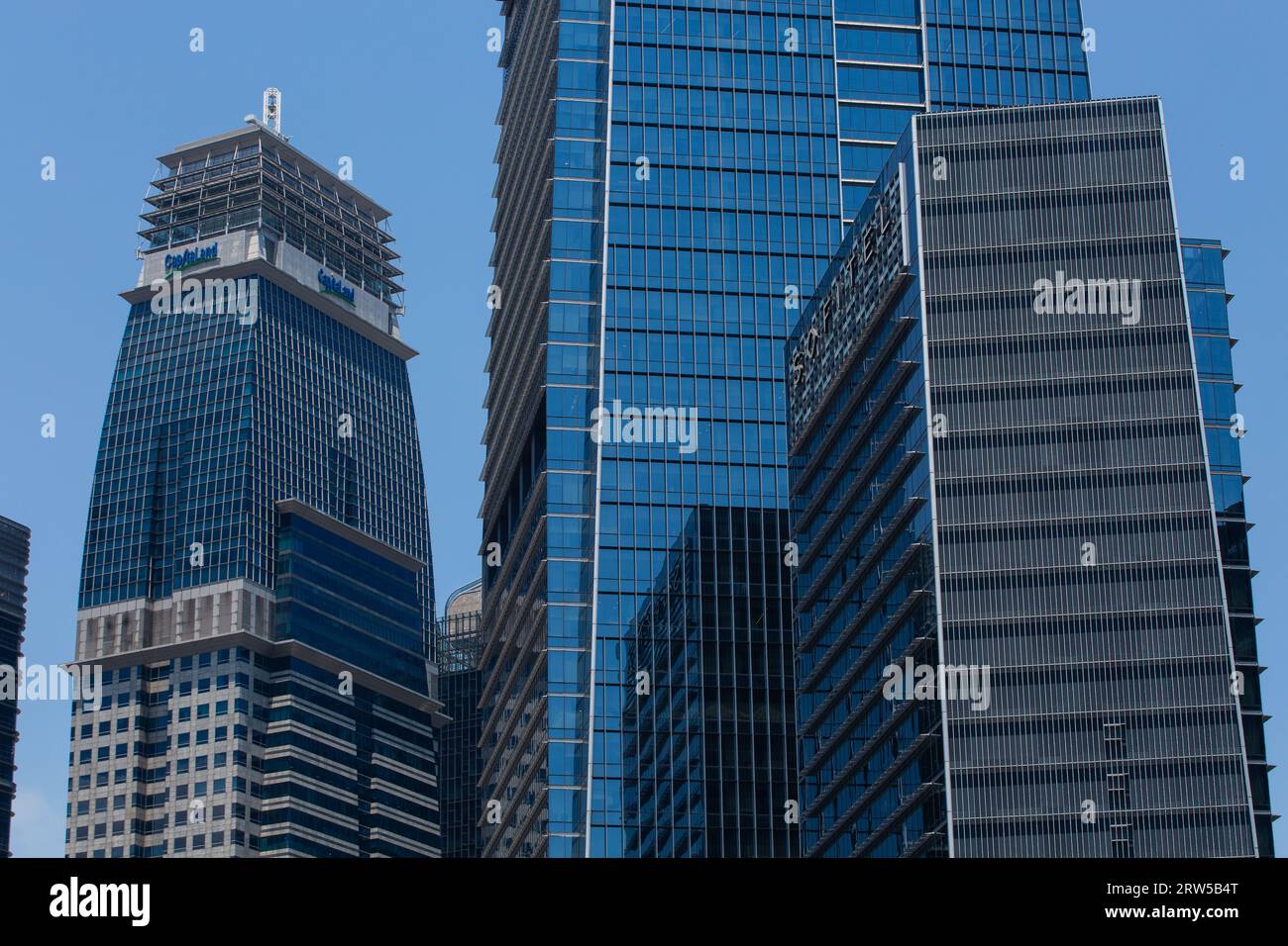 Close up of various skyscraper towers in sunny Singapore. Business from ...