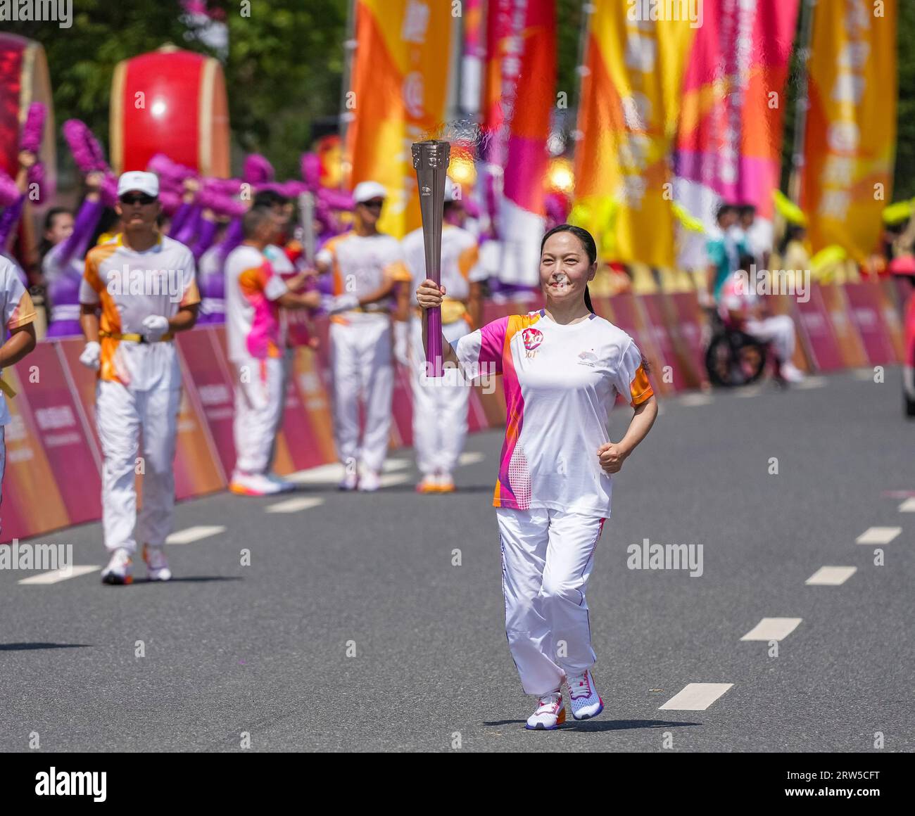 Jinhua, China's Zhejiang Province. 17th Sep, 2023. Torch bearer CHen ...