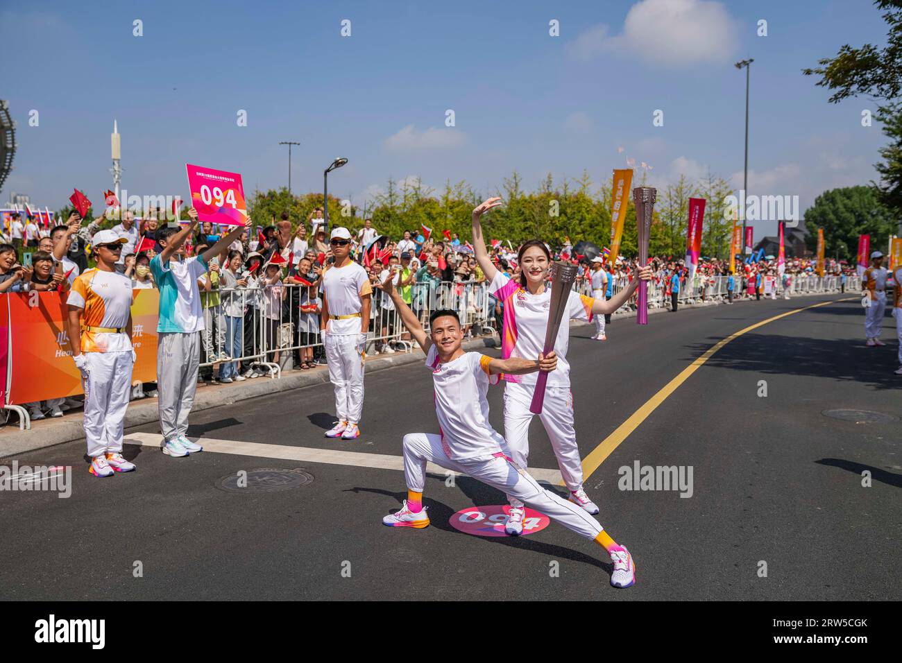 Jinhua, China's Zhejiang Province. 17th Sep, 2023. Torch bearers Weng Ying (Top) and Lou Sheng ...