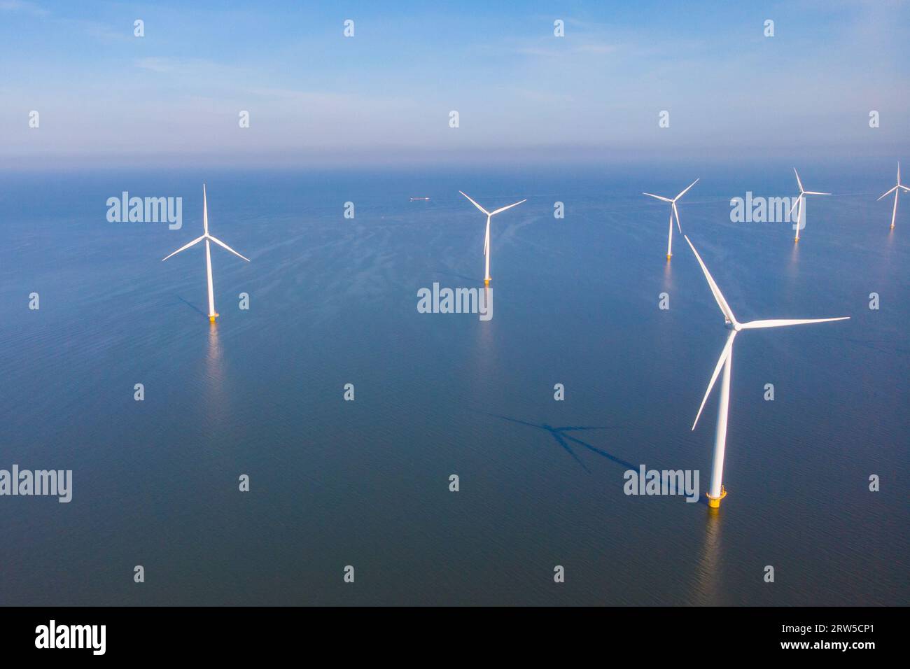 Ocean Wind Farm. Windmill farm in the ocean. Offshore wind turbines in ...