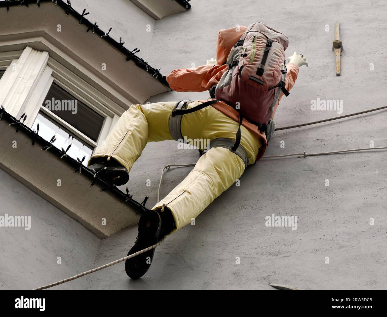 climber on building mannequin puppet detail Stock Photo - Alamy