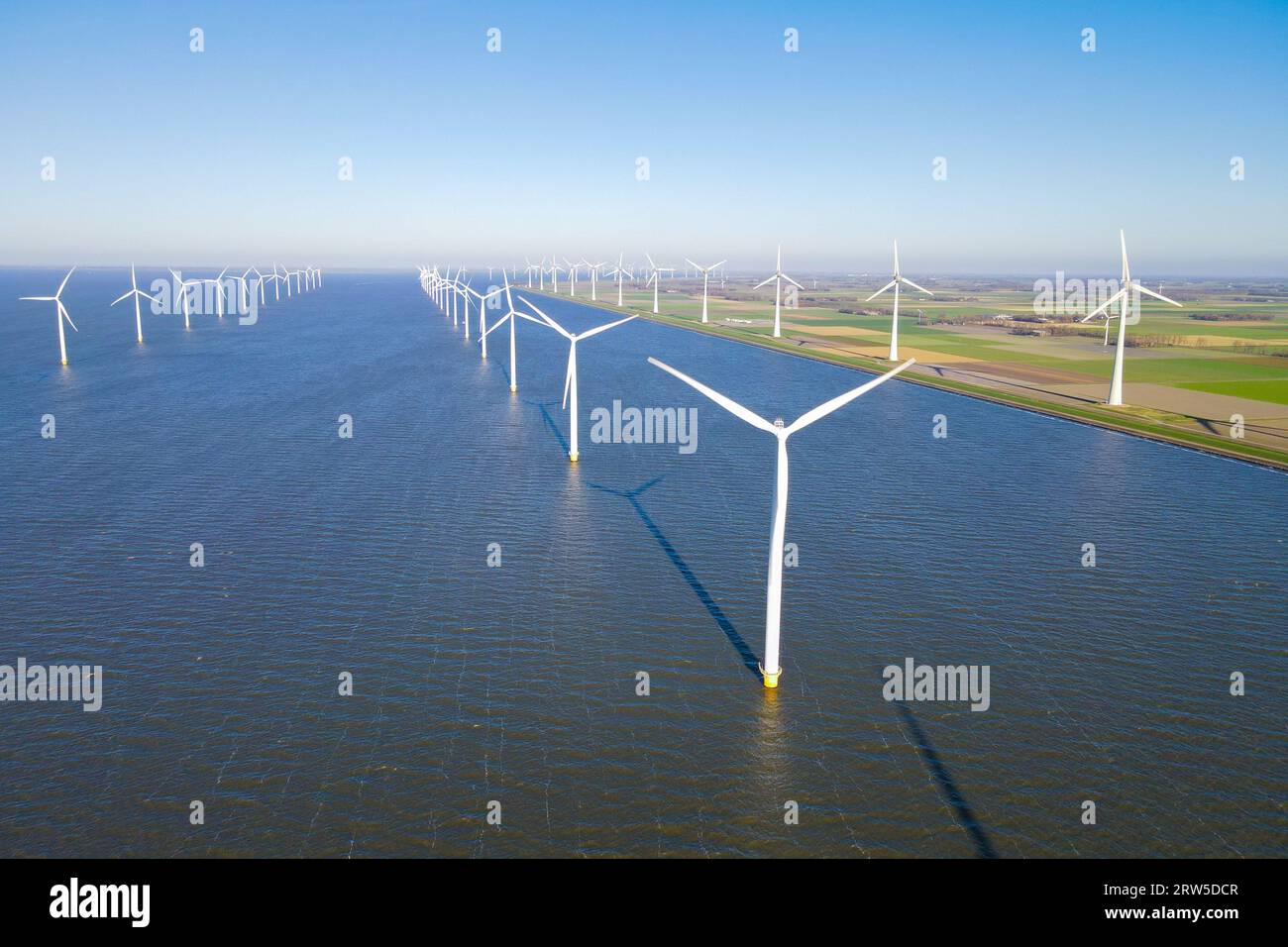Ocean Wind Farm. Windmill farm in the ocean. Offshore wind turbines in ...