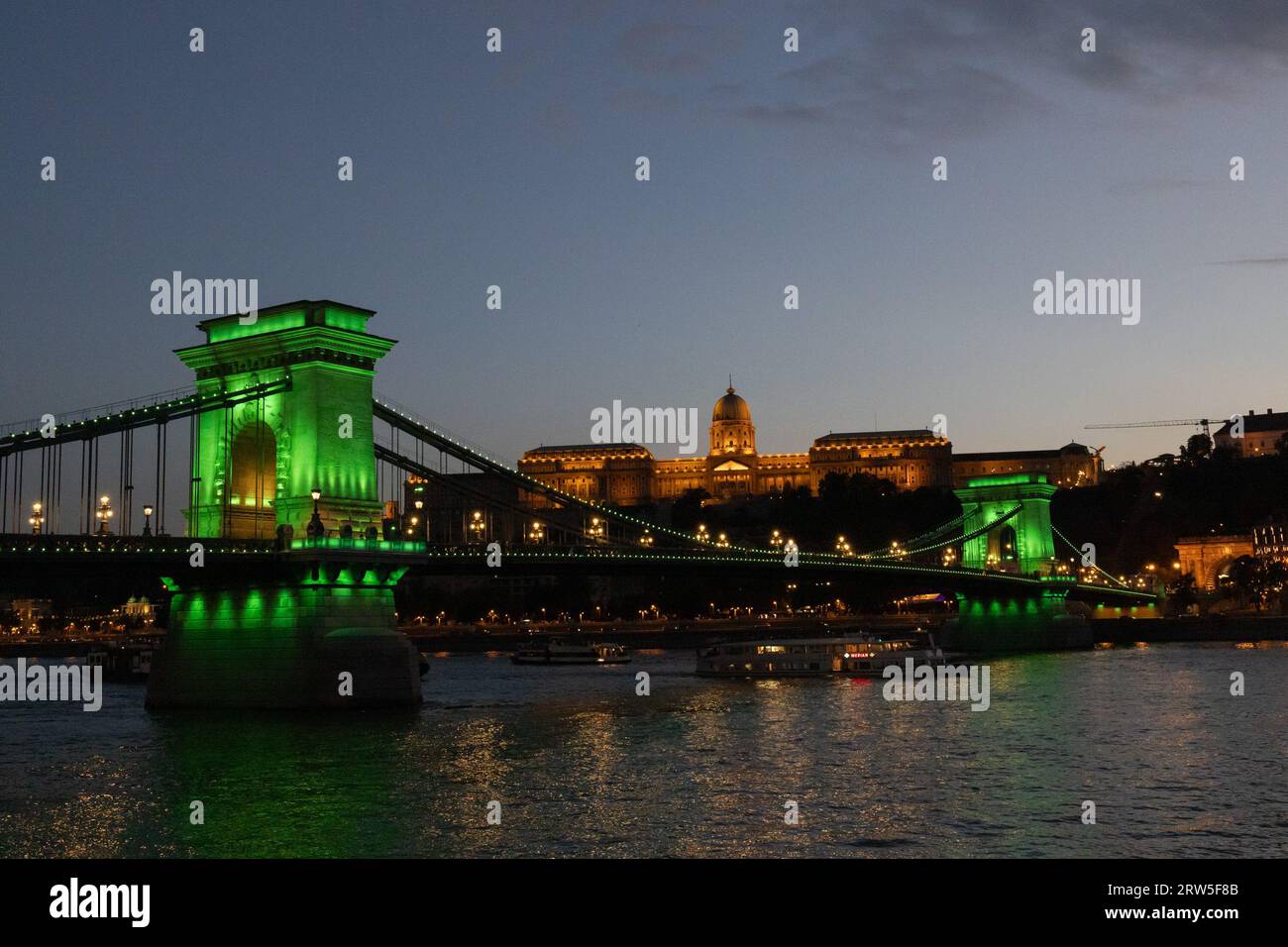 Budapest. 16th Sep, 2023. Budapest's landmark Chain Bridge is seen illuminated with green lights ...